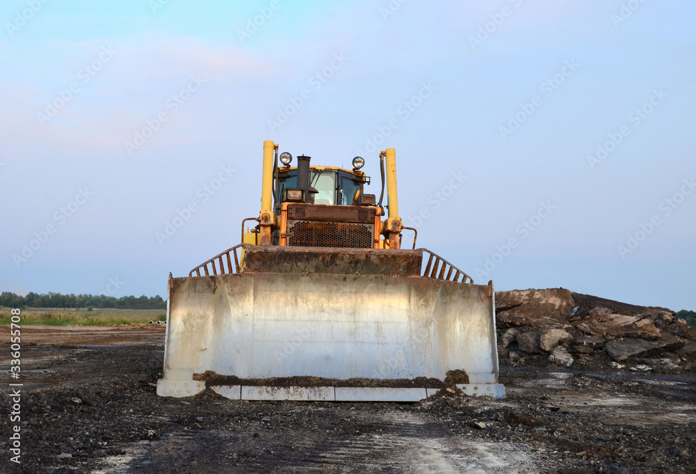 Dozer with bucket for pool excavation and utility trenching. Bulldozer ...