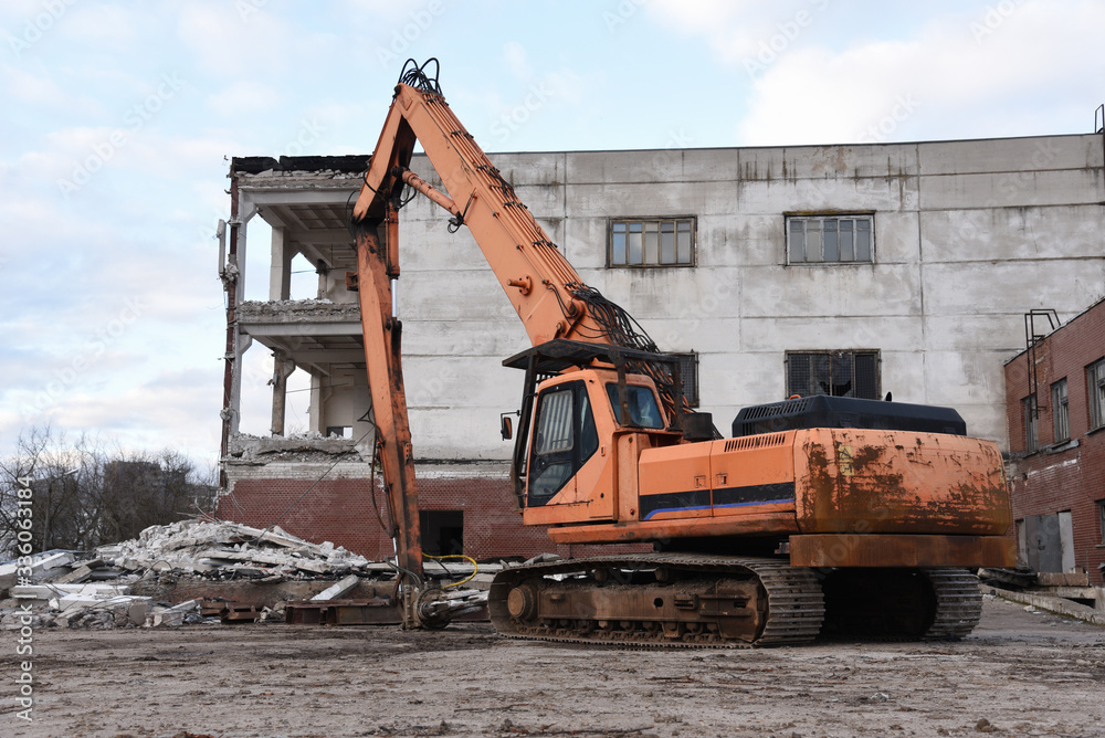 High Reach Excavator machines for demolition of tall building. Machine ...