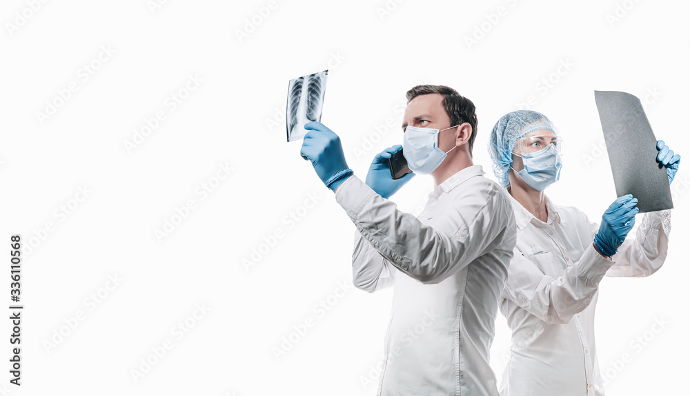 doctors man and woman on a white background in medical masks on the ...