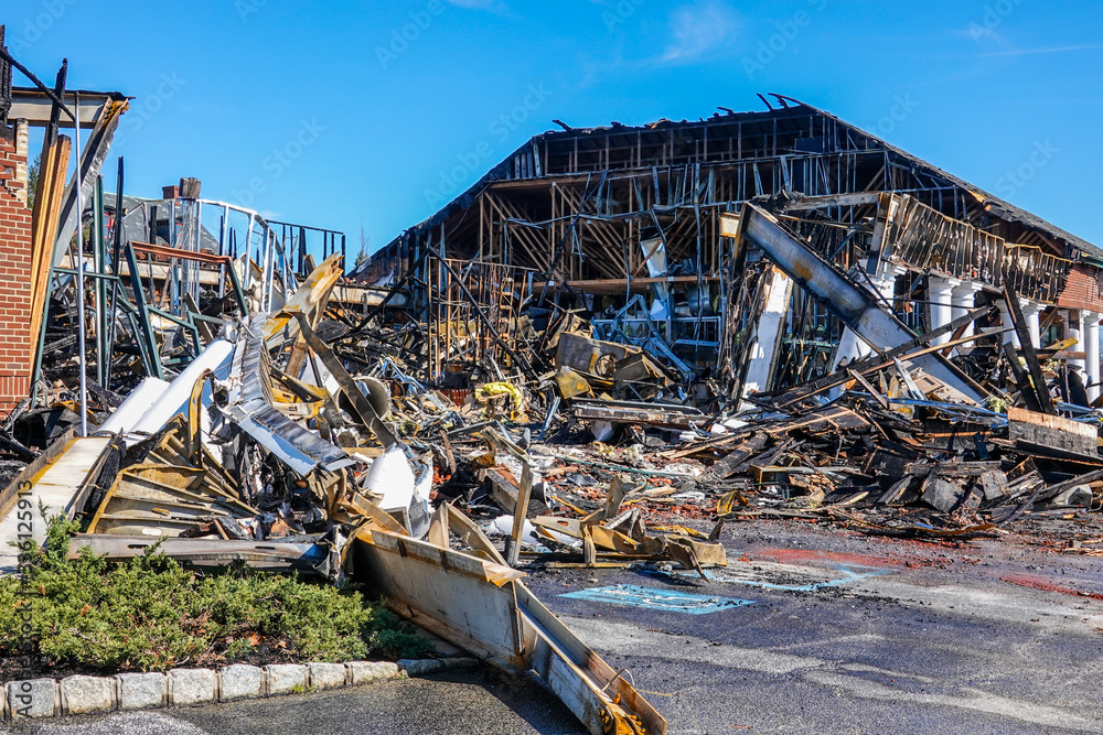 The interior structure of a building destroyed by fire full of debris ...