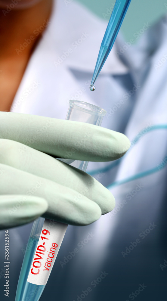 Vaccine and syringe injection. Closeup of a female scientist filling ...