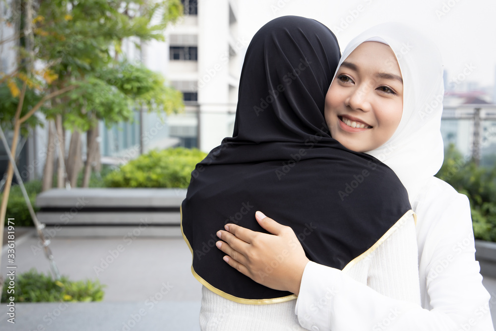 Muslim woman or Muslimah greeting with hug; Concept of Islamic greeting ...