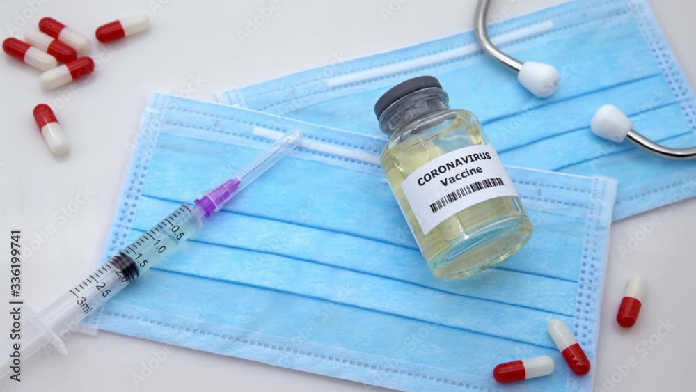 4K, Vaccine and syringe injection for Covid-19 on face mask in the ...