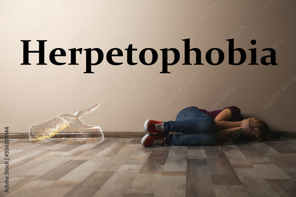 Scared little girl suffering from herpetophobia on floor indoors. Fear ...