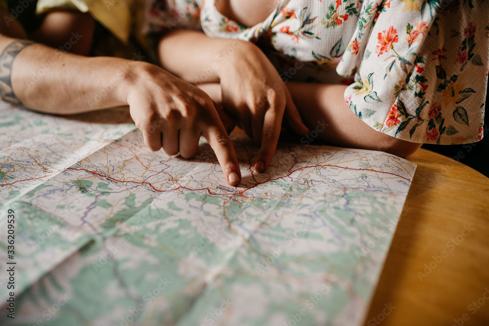 Detail of a couple's hand pointing out a destination on a map Stock ...