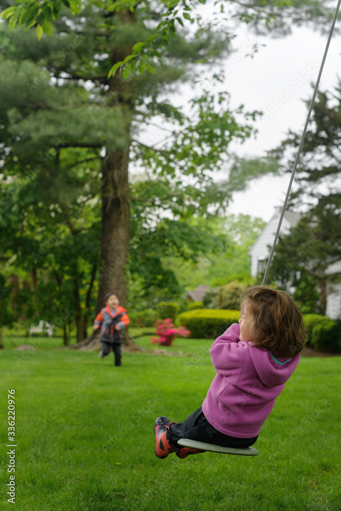 Little kids playing outside Stock Photo | Adobe Stock