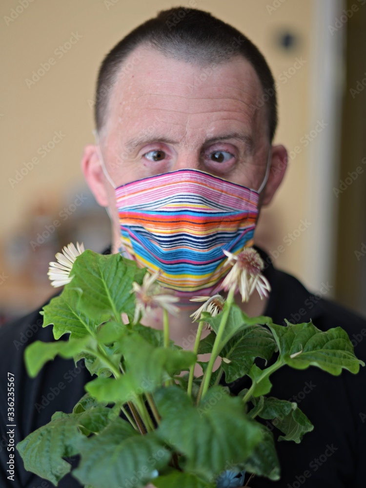 man with down syndrome with respirator mask Stock Photo | Adobe Stock