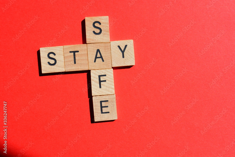 Stay Safe, words in 3d wooden alphabet letters on red background Stock ...