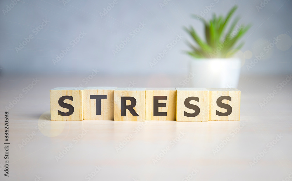 Stress - words from wooden blocks with letters, feel worried and ...