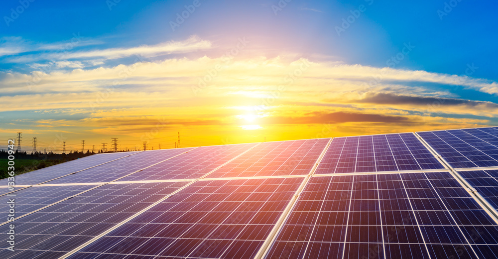 Foto de Photovoltaic solar panels and high voltage power lines at ...