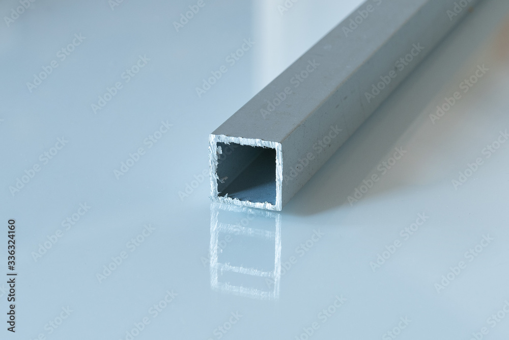 Material education: Rectangular aluminium tube on white background ...
