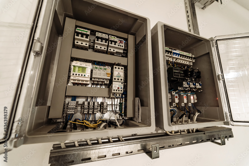 Electrical panel at a assembly line factory. Controls and switches ...
