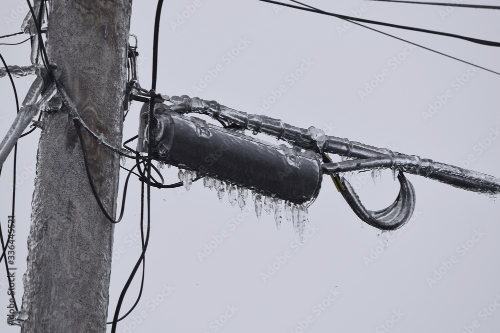 power line transformer covered in ice, closeup power line transformer ...