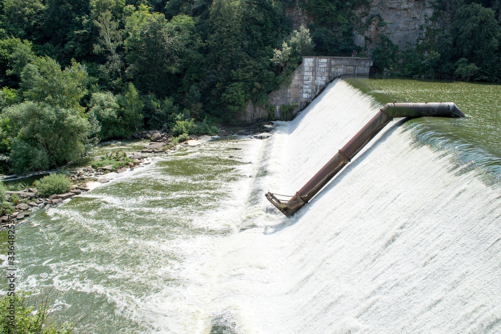 Water flowing from dam. Overflow of water from the dam. Stock Photo ...
