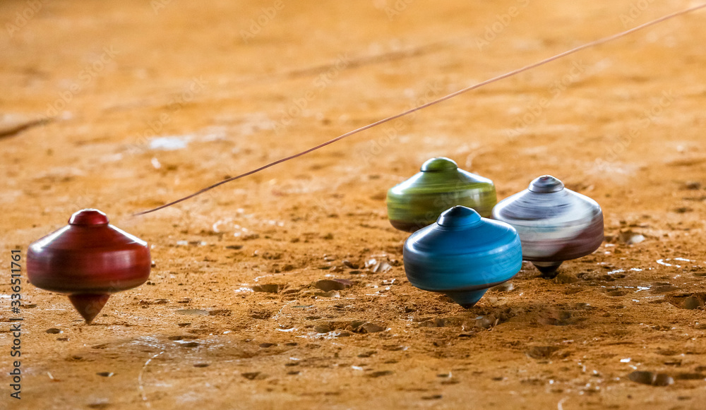 A traditional game called gasing or tops spinning. Gasing is Malaysia ...