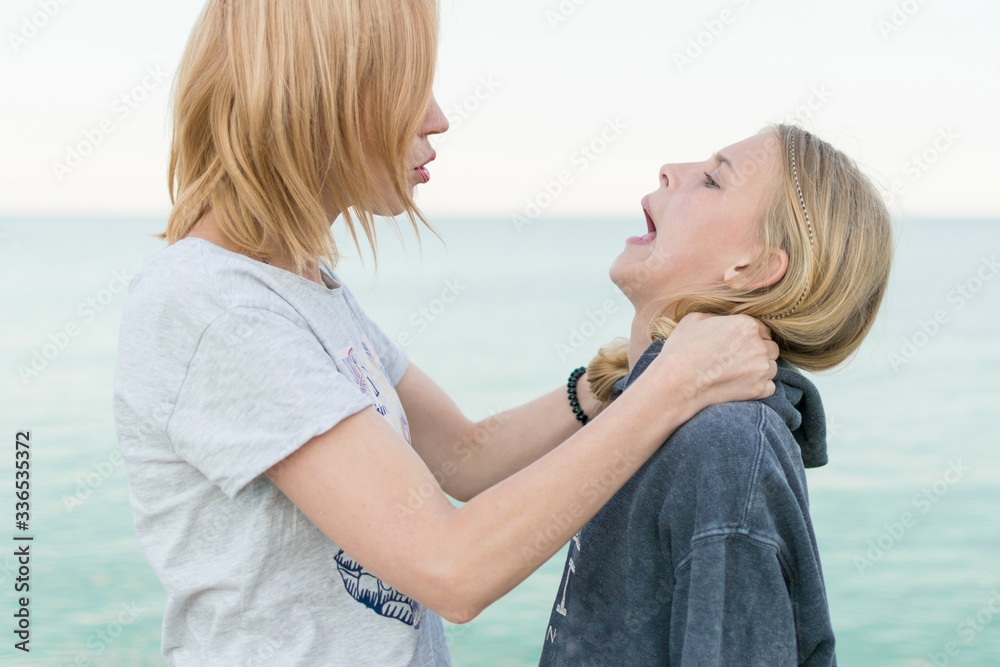 Mother and daughter are teenagers in conflict, grievances, unpleasant ...