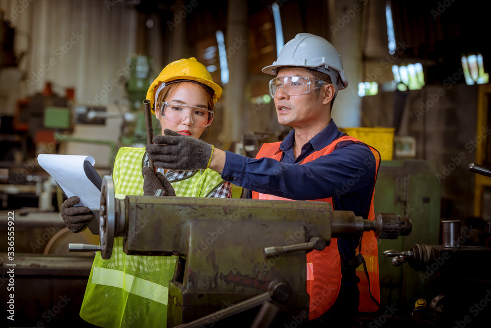 The Industry engineering and worker wearing glass, safety uniform used ...