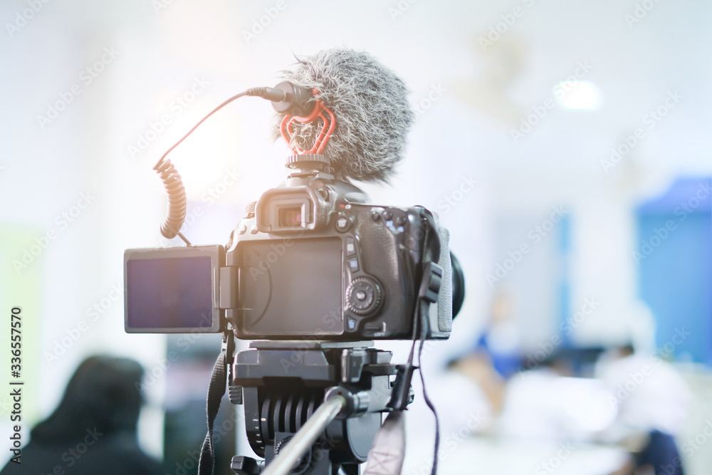 camera set up on tripod recording presentation performance, vlog ...