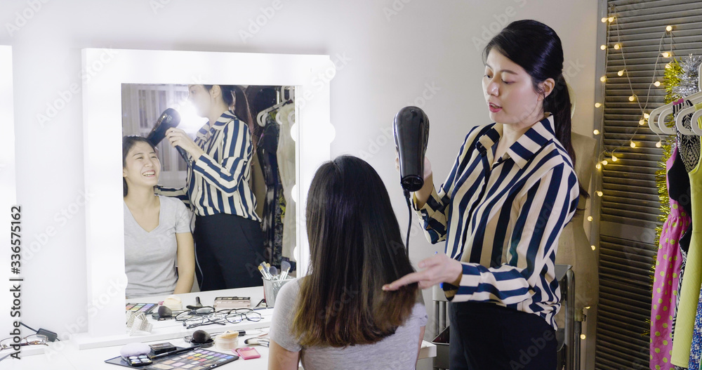 mirror reflection of young girl model cheerful laughing while sitting ...