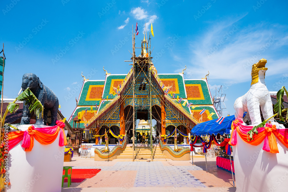 The ceremony of mounting the gable-finial at Phrathat San Don temple ...