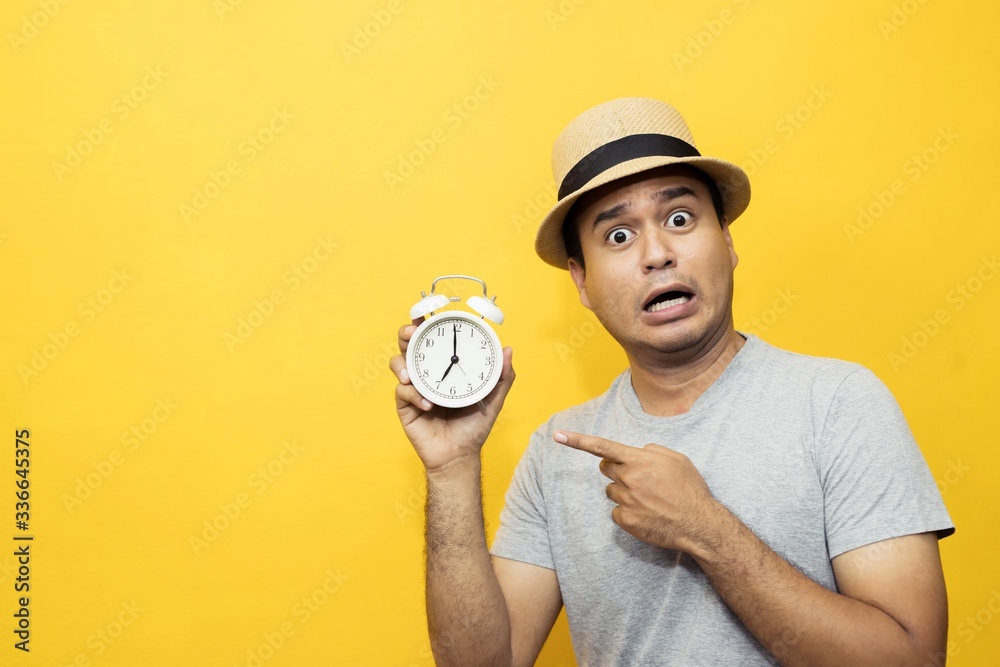 Handsome guy woke up late in the yellow background room Stock Photo ...