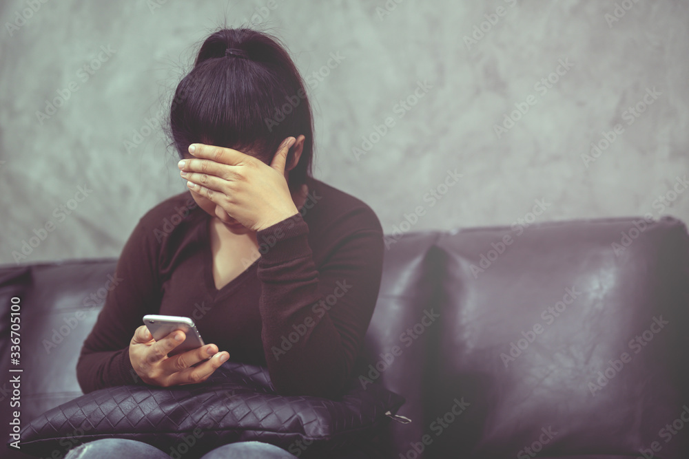 sad people casual wear sitting on sofa using call talking mobile phone ...