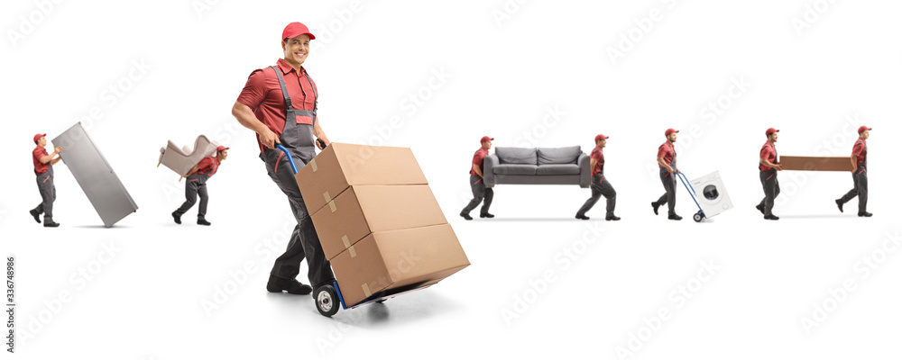 Male worker pushing a hand-truck and other workers carrying furniture ...