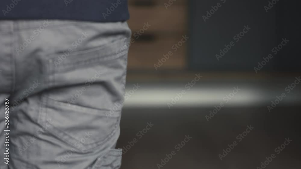 Anonymous young boy loading and pointing a nine millimeter toy gun ...