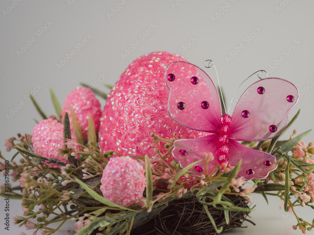 Pink and green nest wreath with a large pink Easter egg and smaller ...