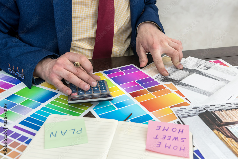 Home designer work at office house sketch with color catalog for dream ...