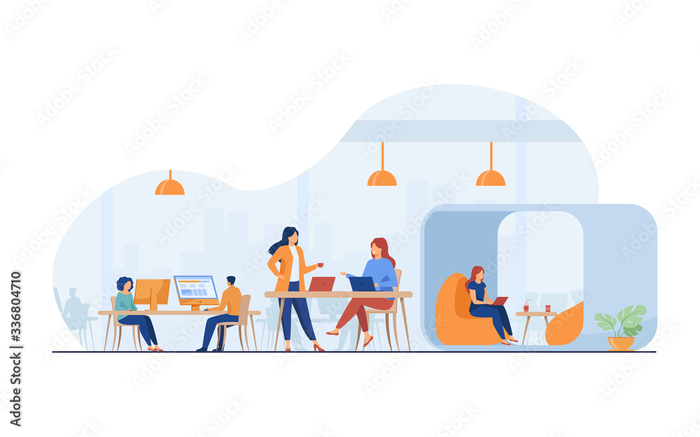 Modern business team working in open office space. Young people using ...