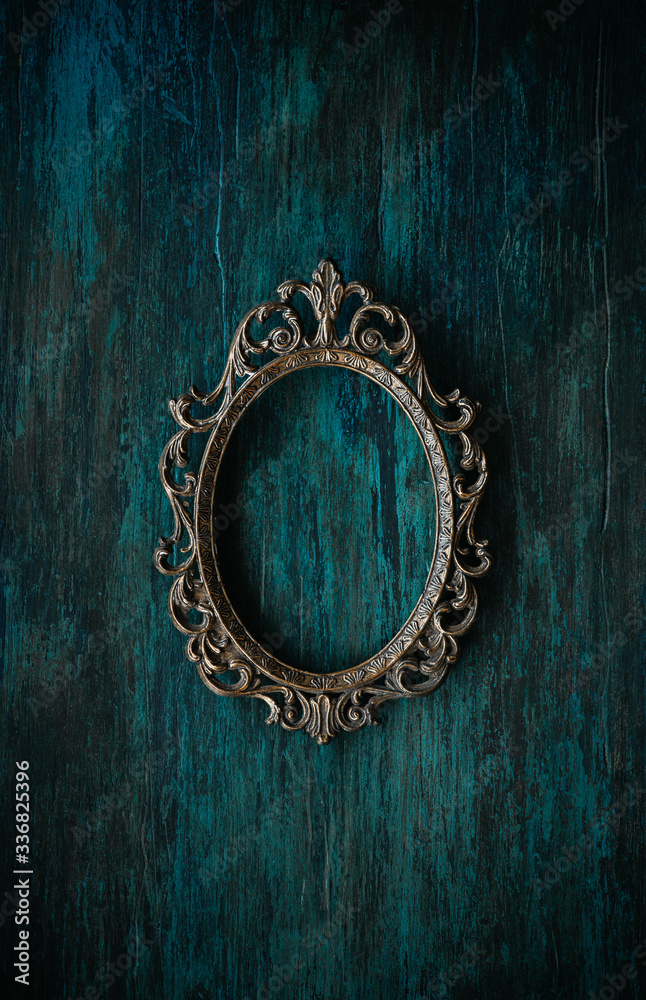 Metal oval frame on a wall Stock Photo | Adobe Stock