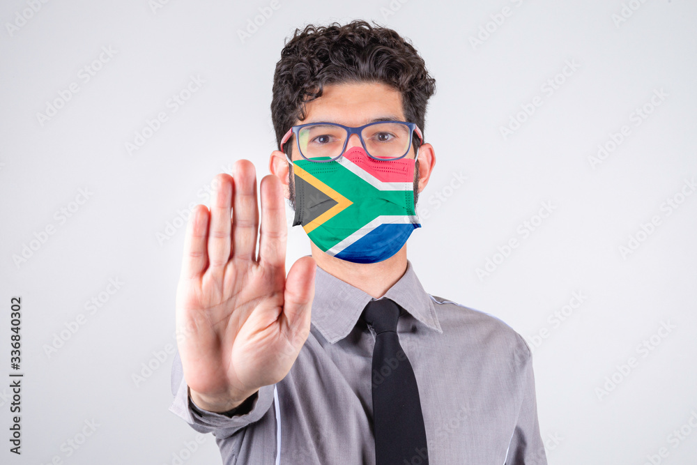Man wearing mask with South African flag asking to keep a social ...