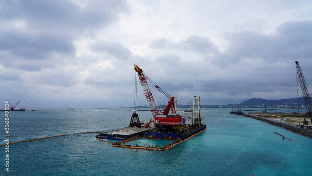 floating crane platform with a huge bucket extracts sand from the ...