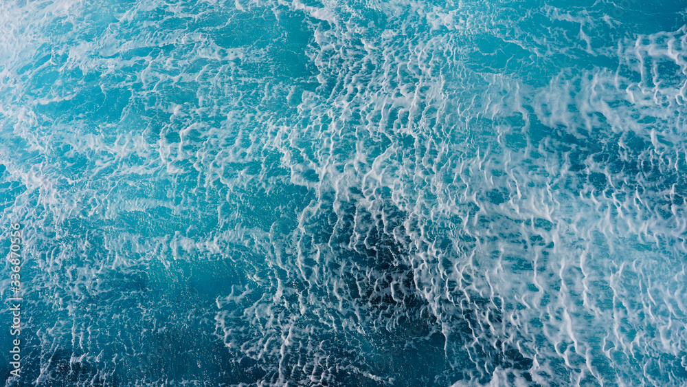 Sea blue water surface background, foam streaks on natural ocean ...