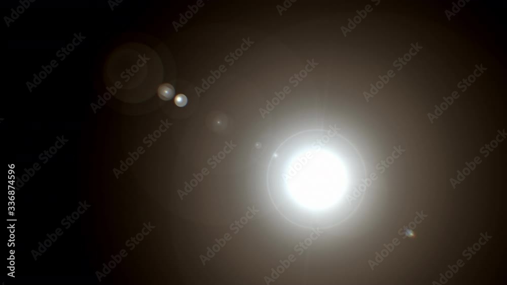 A slow monochromatic lens flare, moving from the upper left to the ...