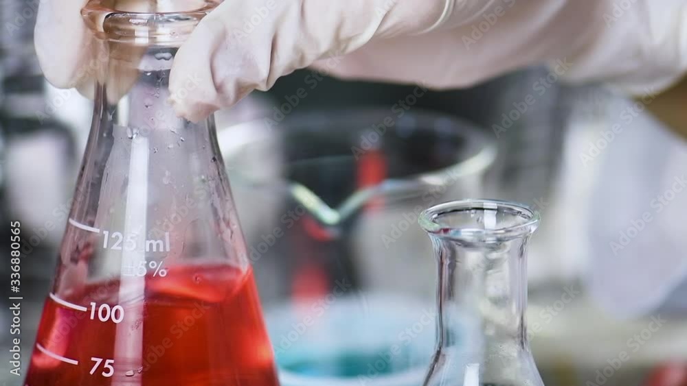 laboratory, scientist pour color liquid solution to test Beaker for ...