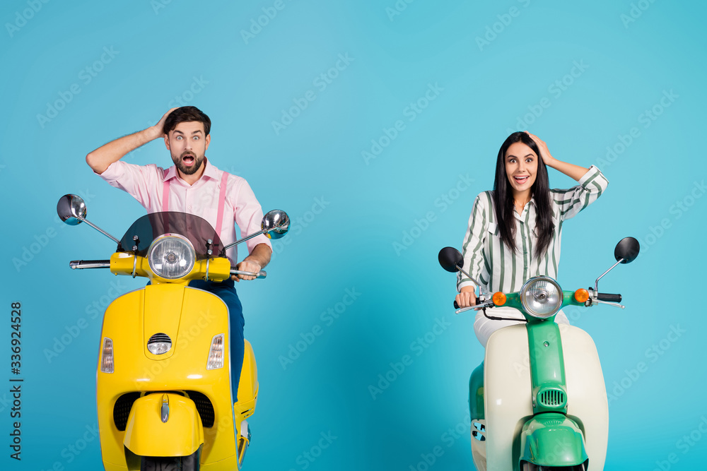Surprised impressed tow people bikers man woman drive motor bike touch ...