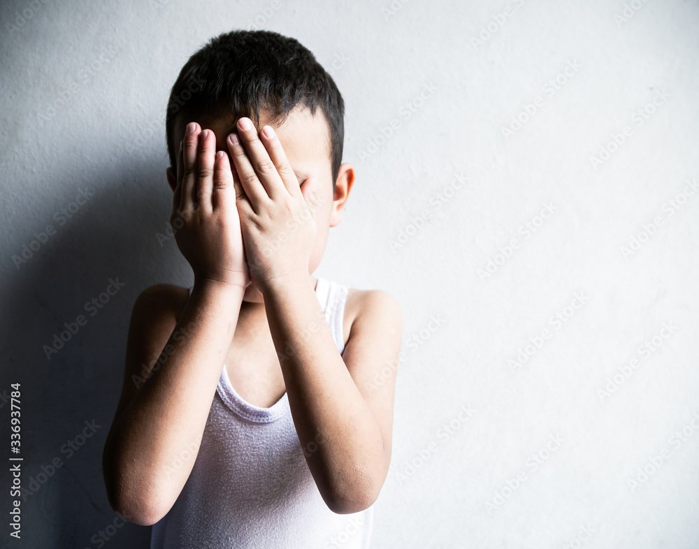 Boy shouts covered his face with his hands. concept for bullying ...