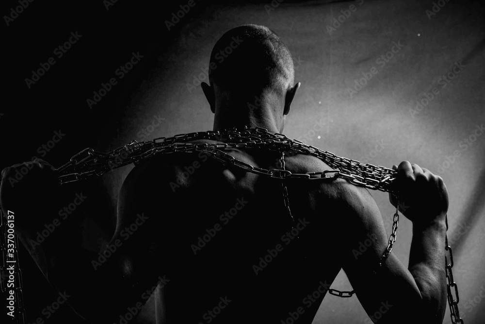 Pumped athlete's back. Back. Chain on back. Sport. Black and white ...