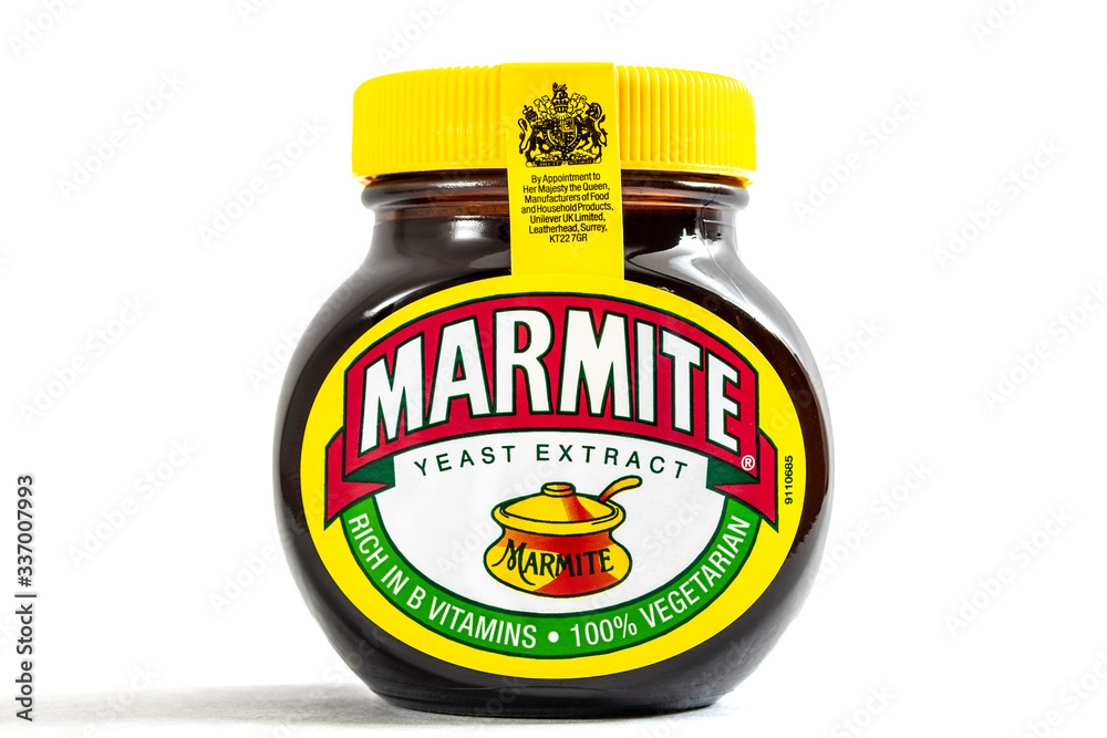 London, UK - August 10 2018: An unopened jar of Marmite over a plain ...