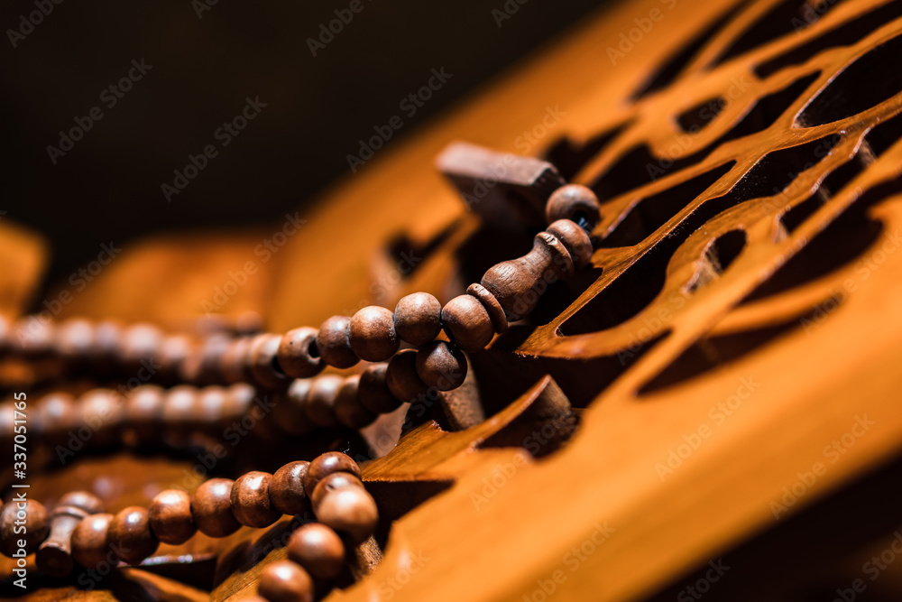 Islamic prayer beads or tasbih on rihal or quran book stand made from ...