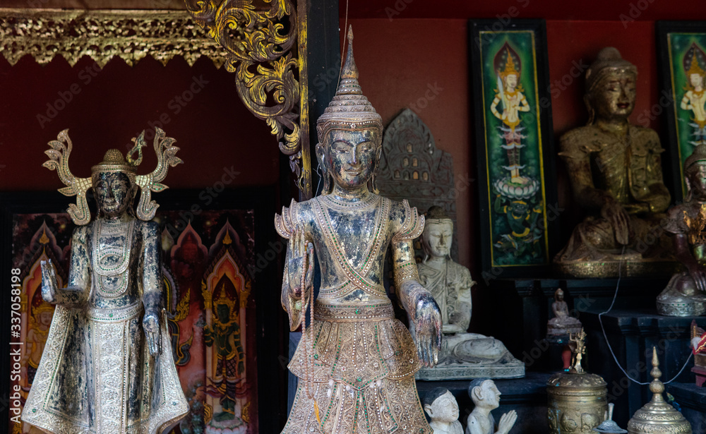 .Buddhist and Hindu statues of deities in ritual rites and traditions ...
