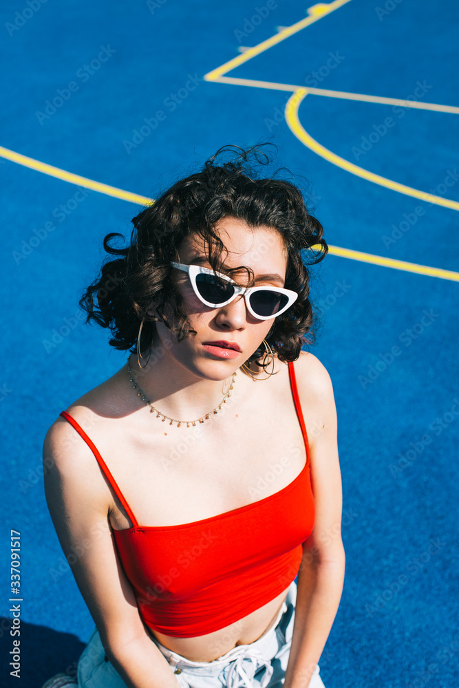 Cute Female Gen Z Teenager on Blue Background Stock Photo | Adobe Stock