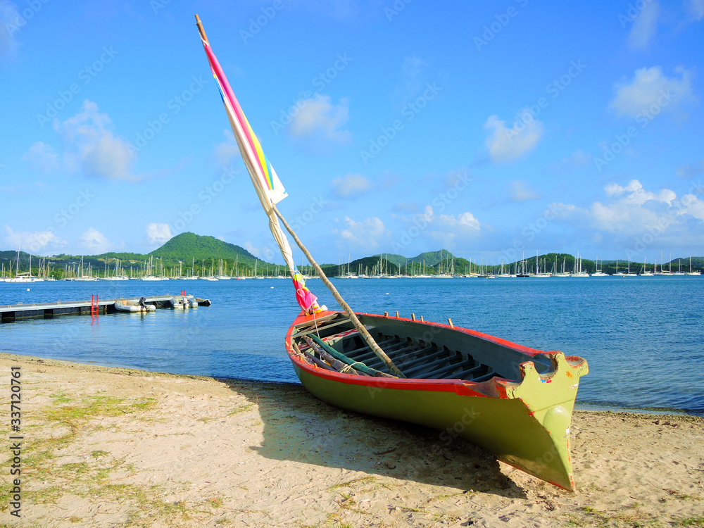 Classic racing sailing boat of the yole ronde (yawl boat) type, French ...