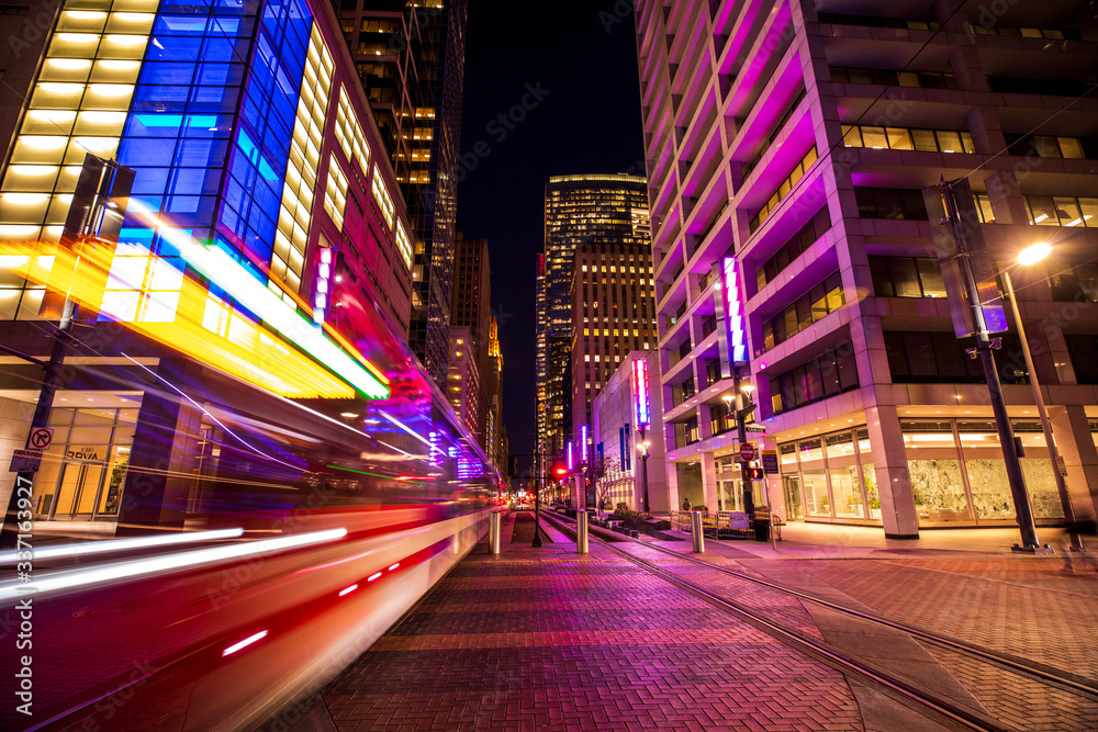 Long exposure shot of a light rail train zooming through Houston, Texas ...