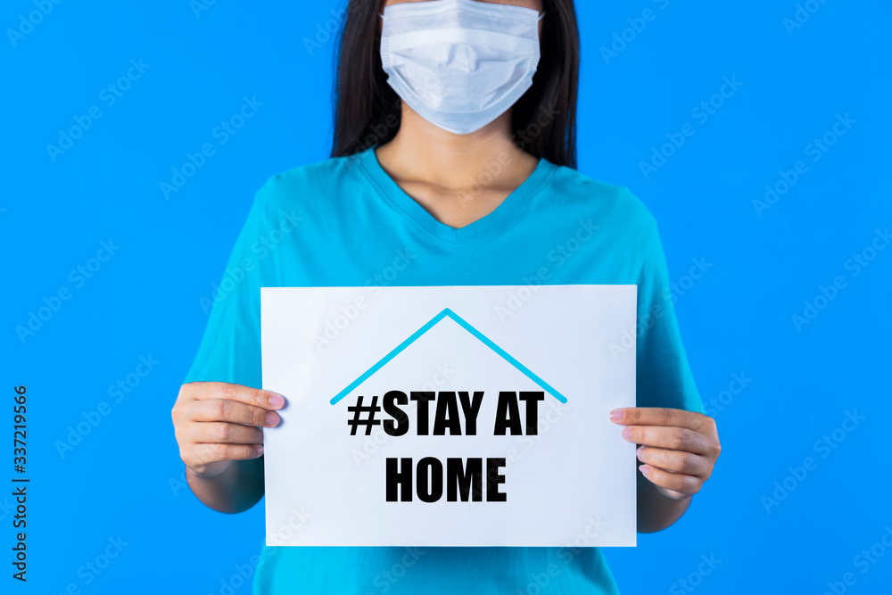 Female wearing mask protect virus and holding blank sheet with text ...