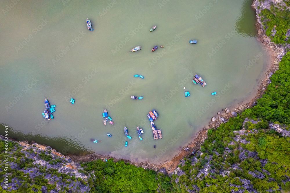Aerial view Ba Hang floating fishing village, rock island, Halong Bay ...