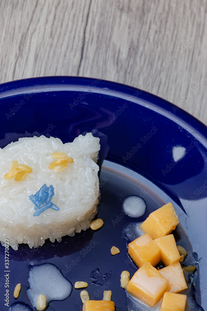 Thai Sweet Sticky Rice in bear shape with fresh mango. A traditional ...