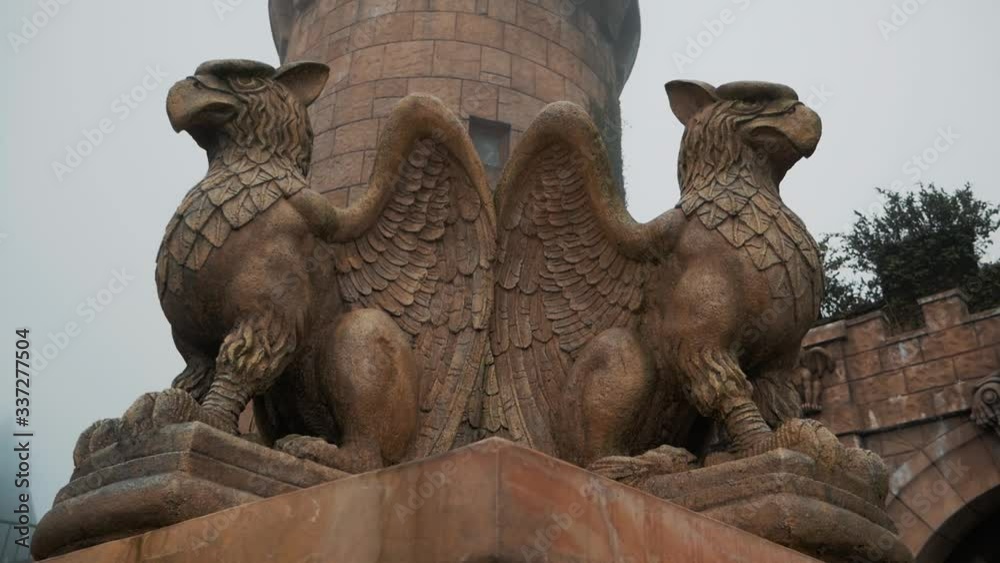 Statue form of a mythological winged creature with the body of a lion ...